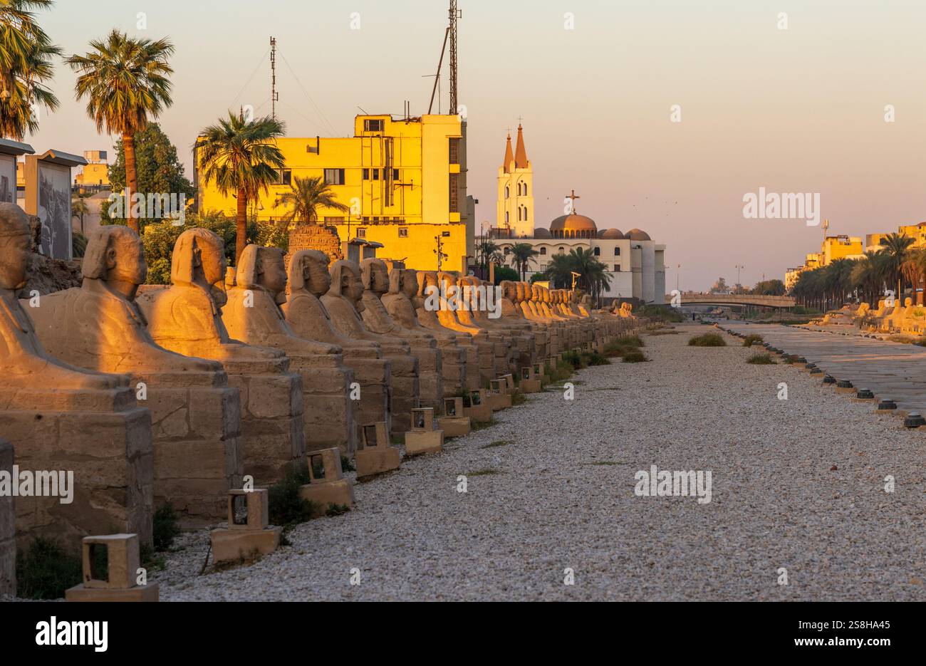 Ancient paved road in Luxor Egypt with remnants of sphinxes lining the ...