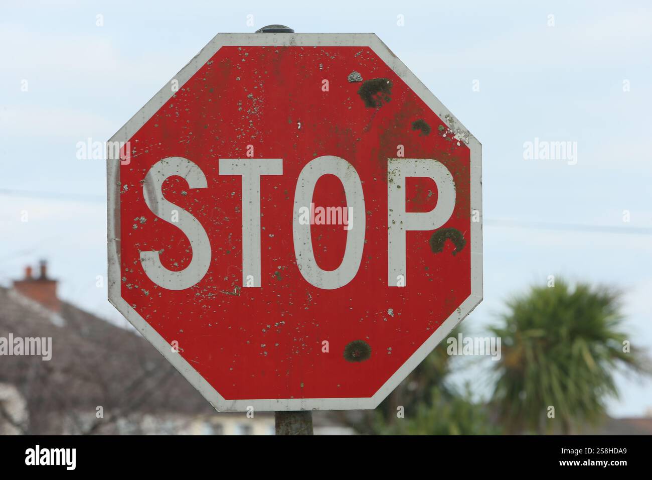 Dublin, Ireland - 19th January 2025 - A weathered and dirty 'Stop' road ...