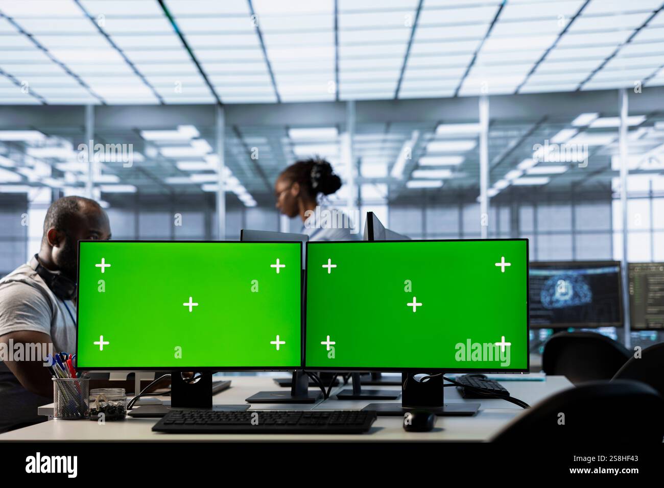 Multi monitor isolated screen computer setup used by engineers working ...