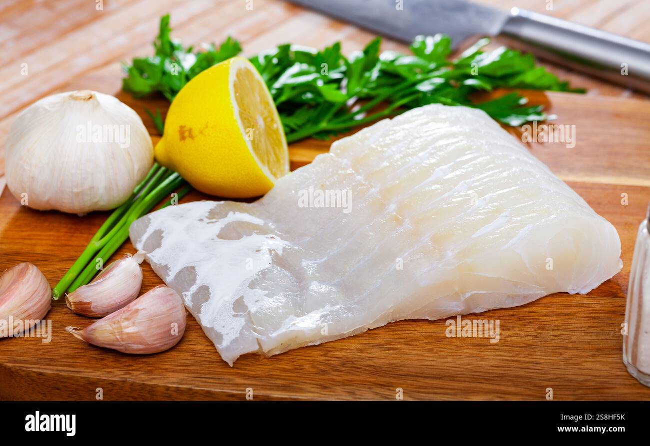 Raw pink cusk-eel fish fillet, seafood ingredients Stock Photo - Alamy