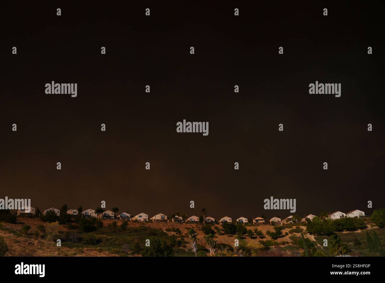 A large plume of smoke caused by the Hughes Fire rises from Castaic ...
