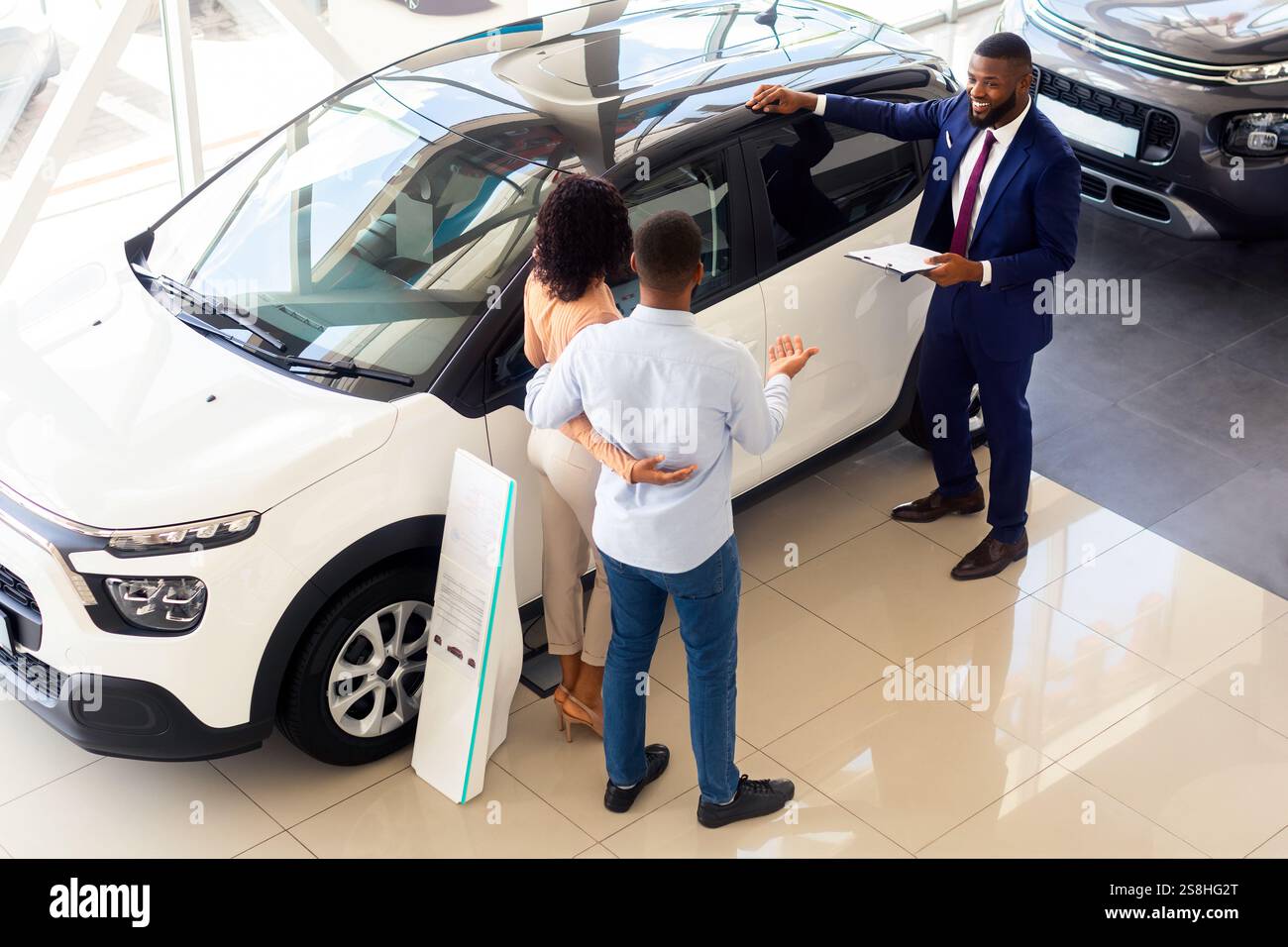 Professional Salesman Advertising New Car For Young Black Customers ...