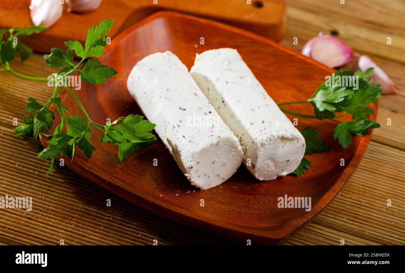 Soft goat cheese with herbs and garlic Stock Photo - Alamy