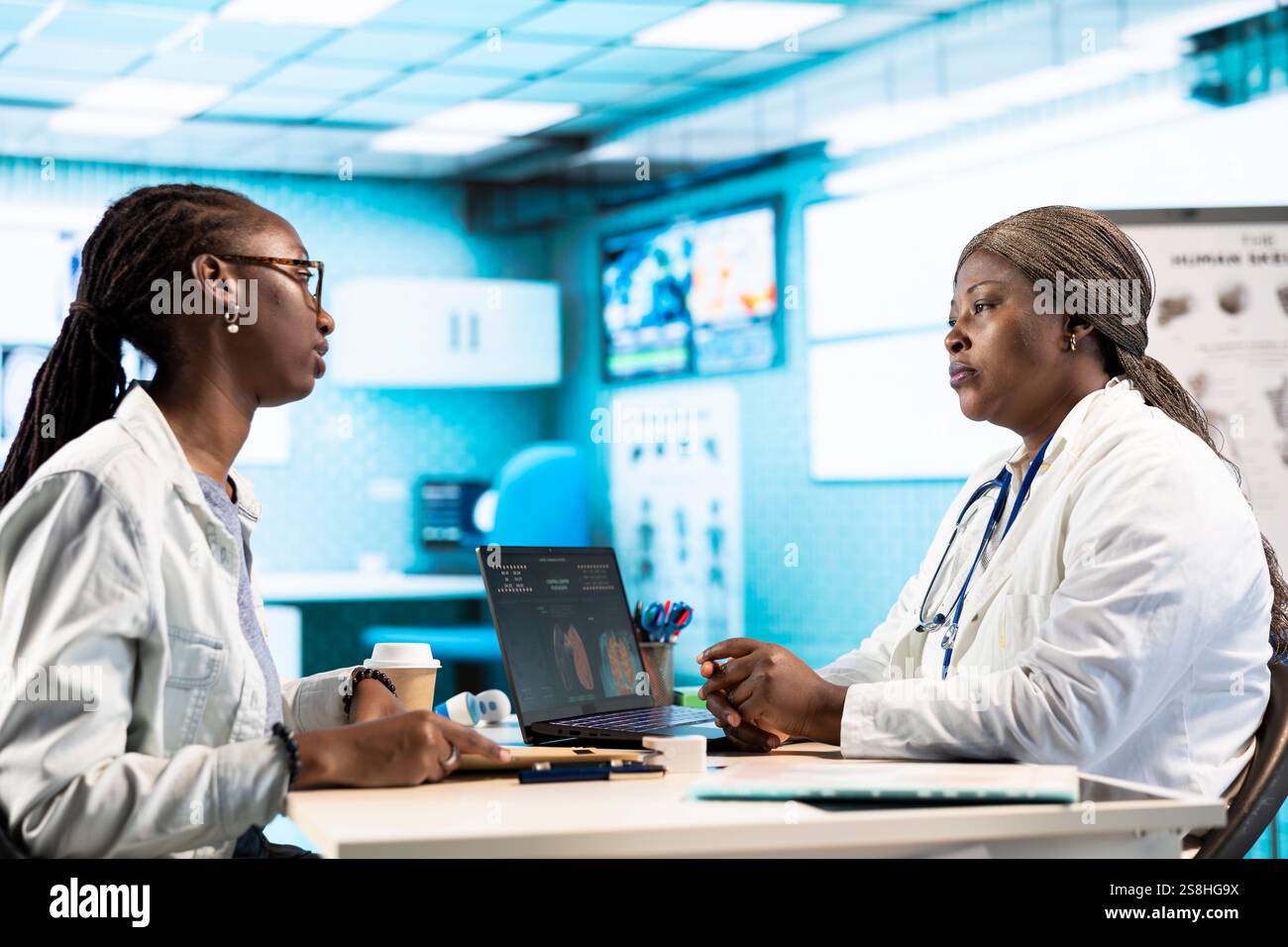 Black medic expert discussing health care concerns with a young woman ...