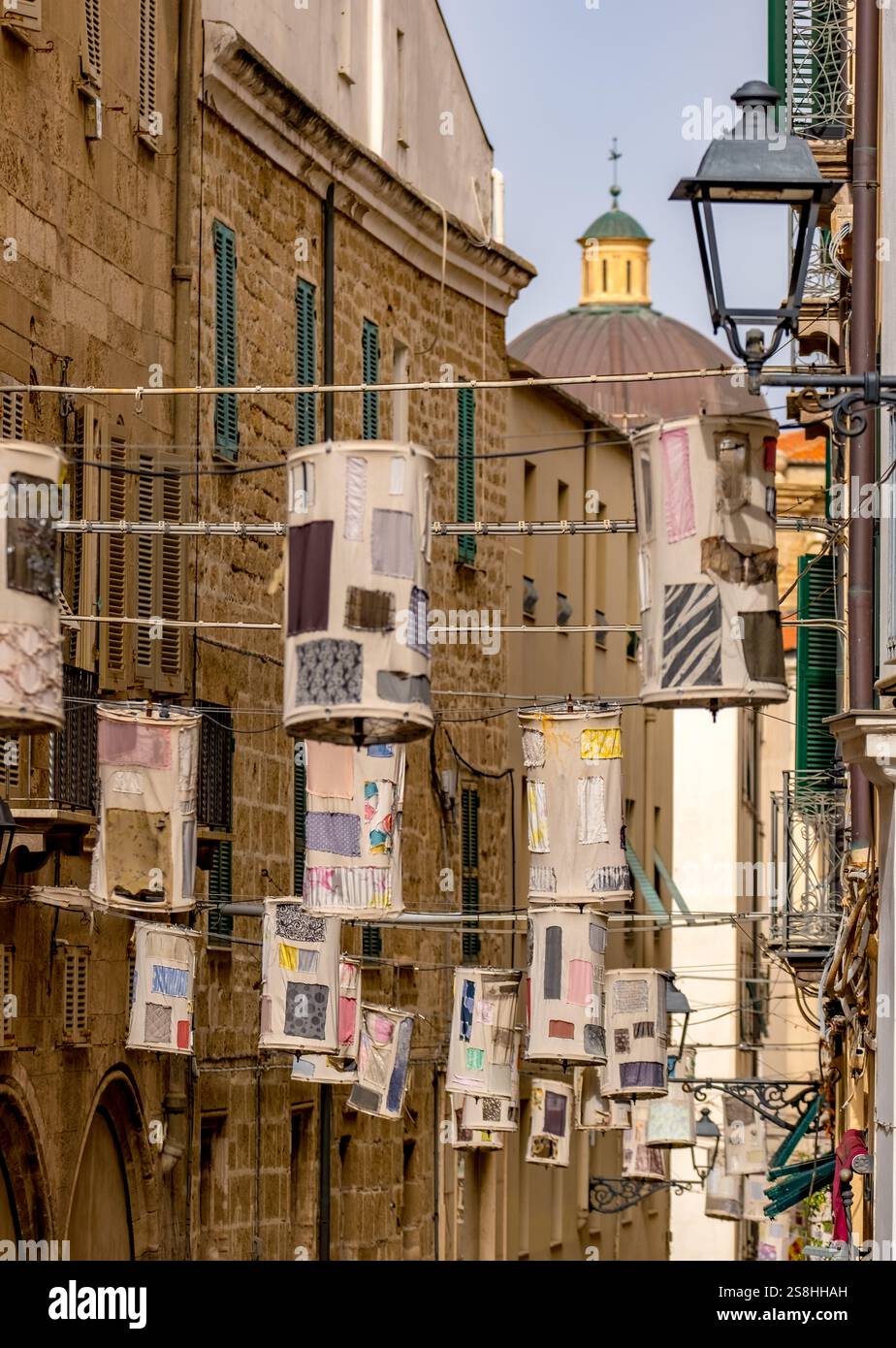 Lampions made from fabric remnants patchwork on power lines between the ...