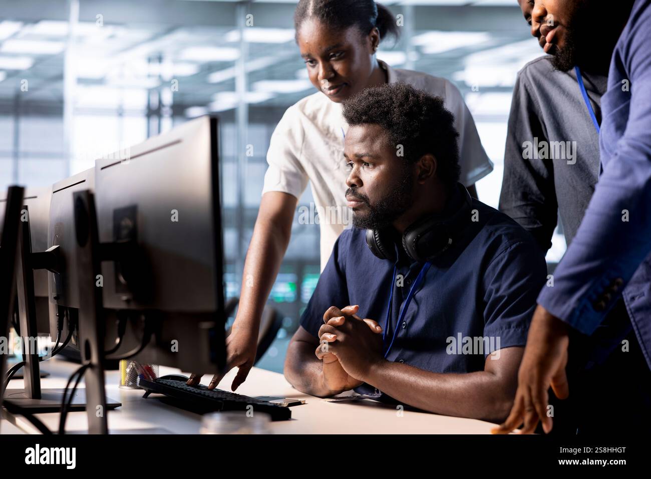 Team of data center employees working together to create technical ...