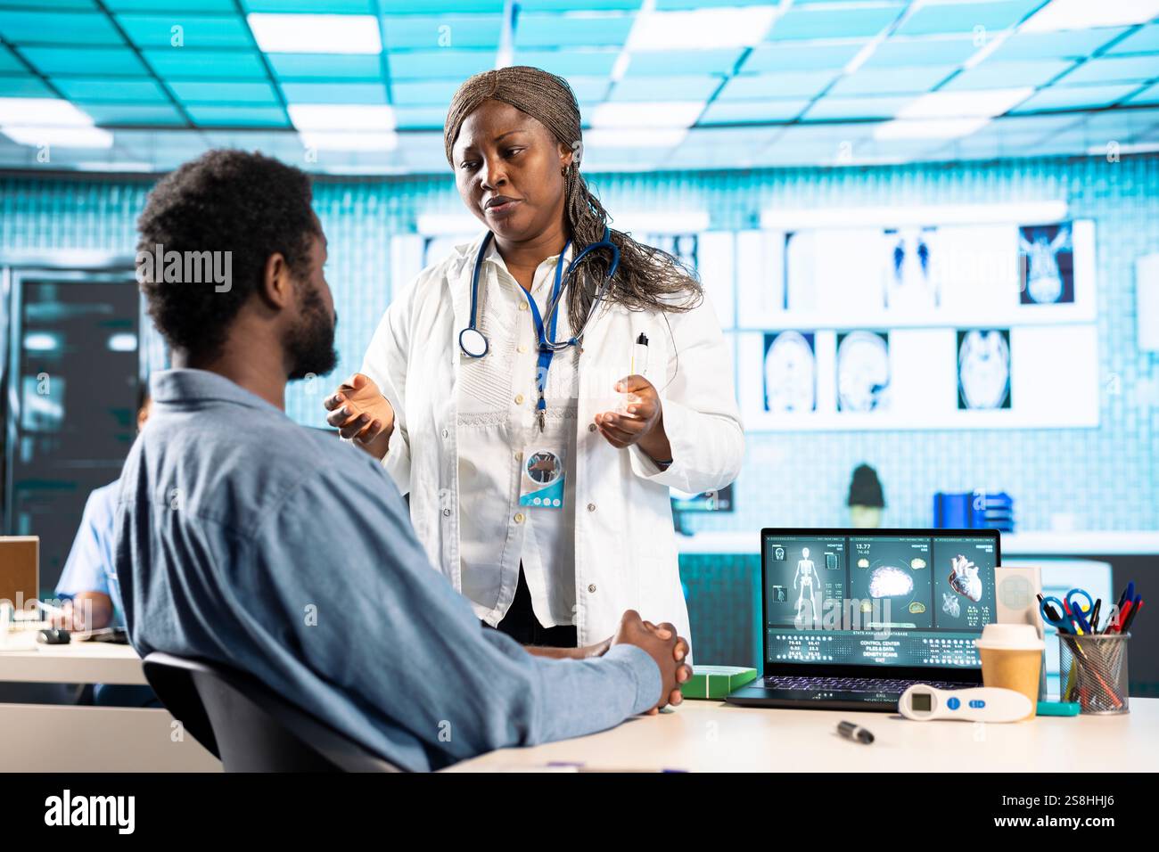 Female professional engaging in a conversation with a man patient ...