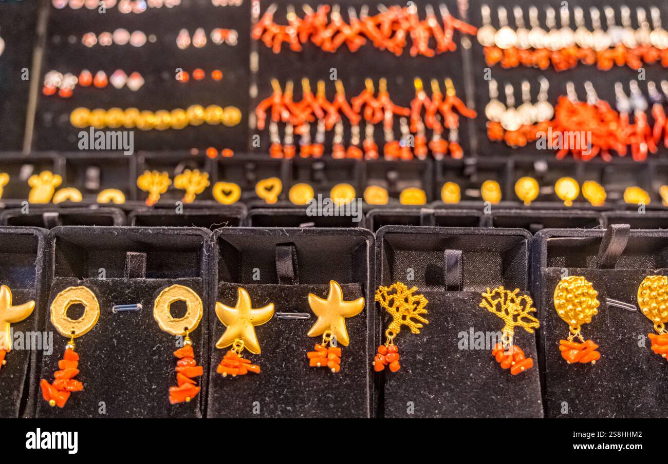 Red jewelry and ear pendant, store display, Alghero, Europe, Province ...