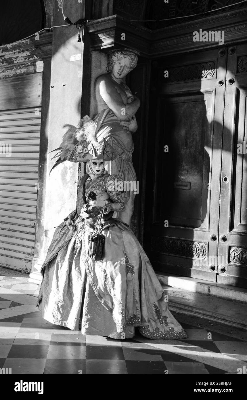Romantic mask with rose between light and shadow. Carnival in Venice ...