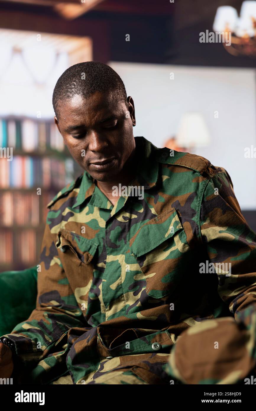 African american army veteran in camouflage clothing sits in therapy ...