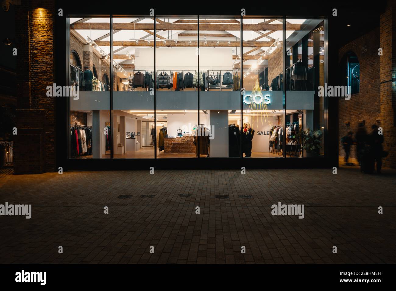 Modern Cos Storefront Display View at Night With Fashion Items and Sale ...