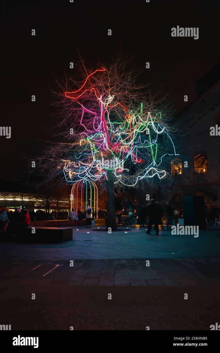 Illuminated Tree Installation with Colorful Neon Lights in a Night time ...