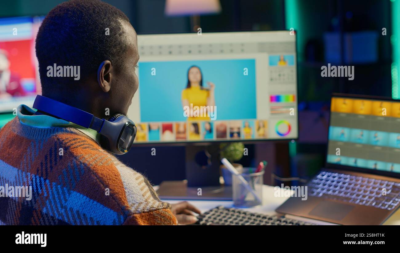 Black man photo editor in a well organized workspace editing images on ...