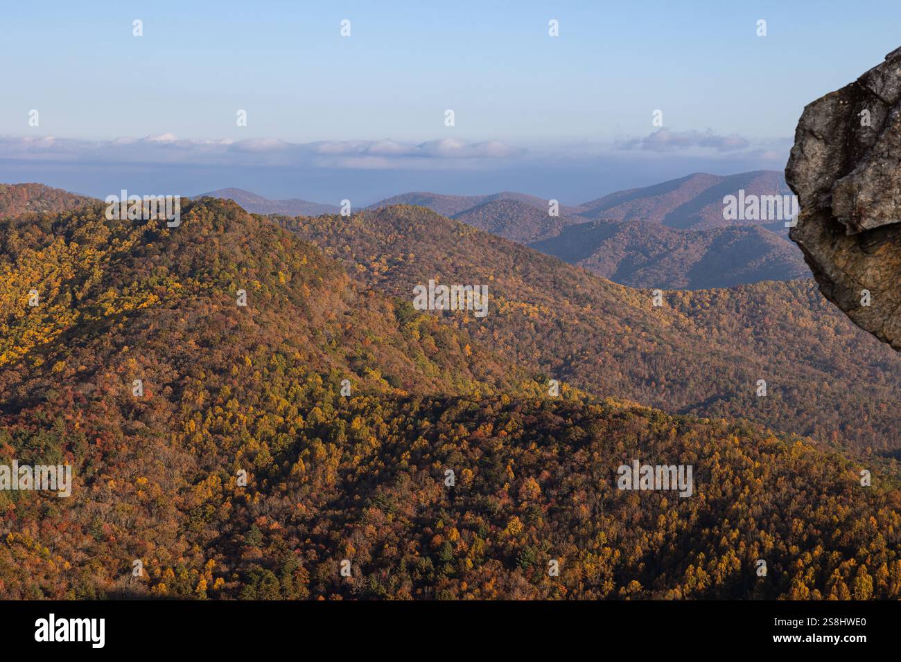 A high altitude scene shot from a mountaintop showcases the fall colors ...