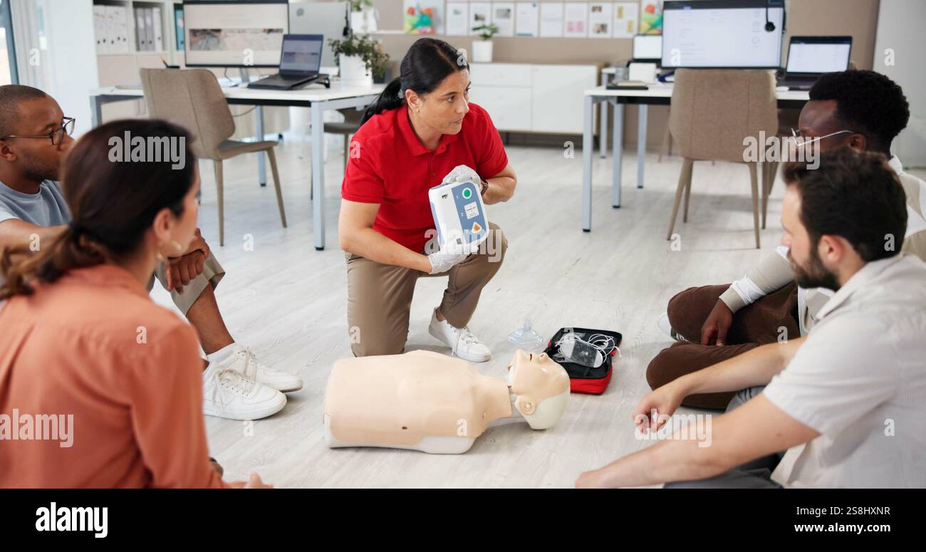 Mannequin, cpr and training with people and defibrillator for first aid ...