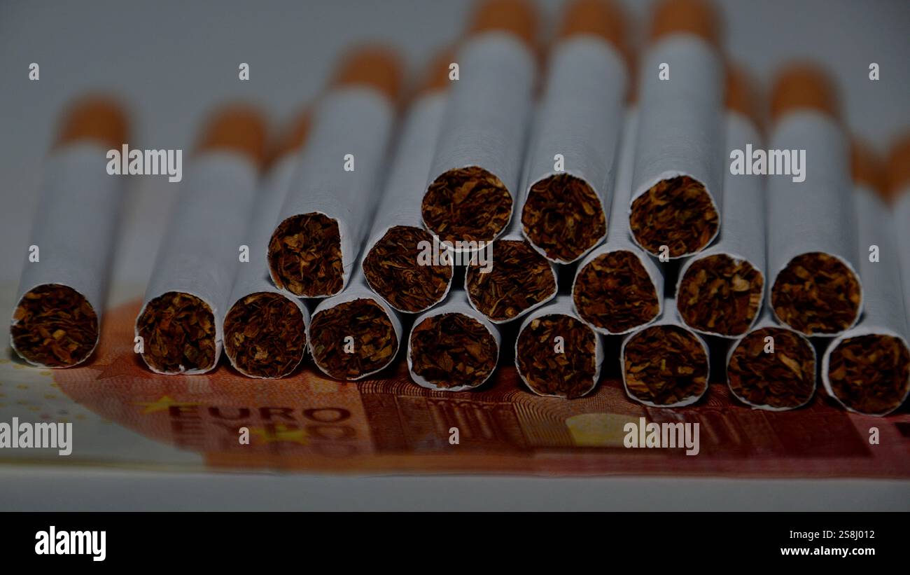 In this photo illustration, cigarettes are seen on a 10 euro banknote ...