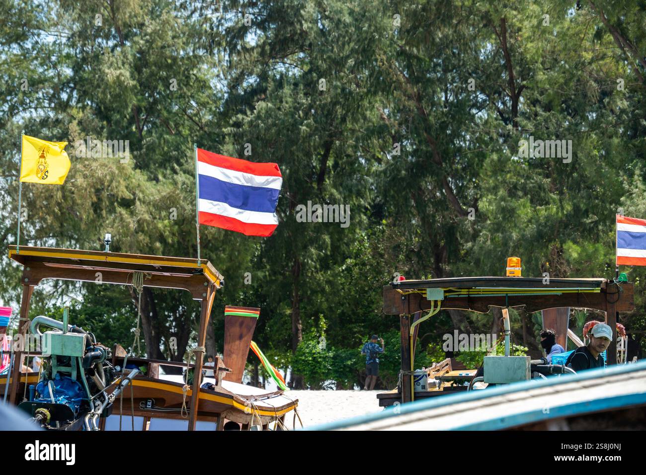 Scenic boat ride under towering limestone cliffs in Thailand's stunning ...