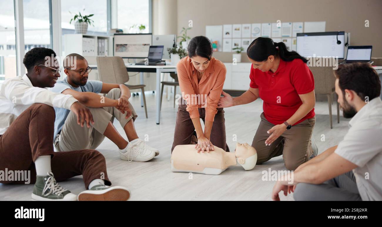 First aid, cpr training and group with dummy for safety compliance ...