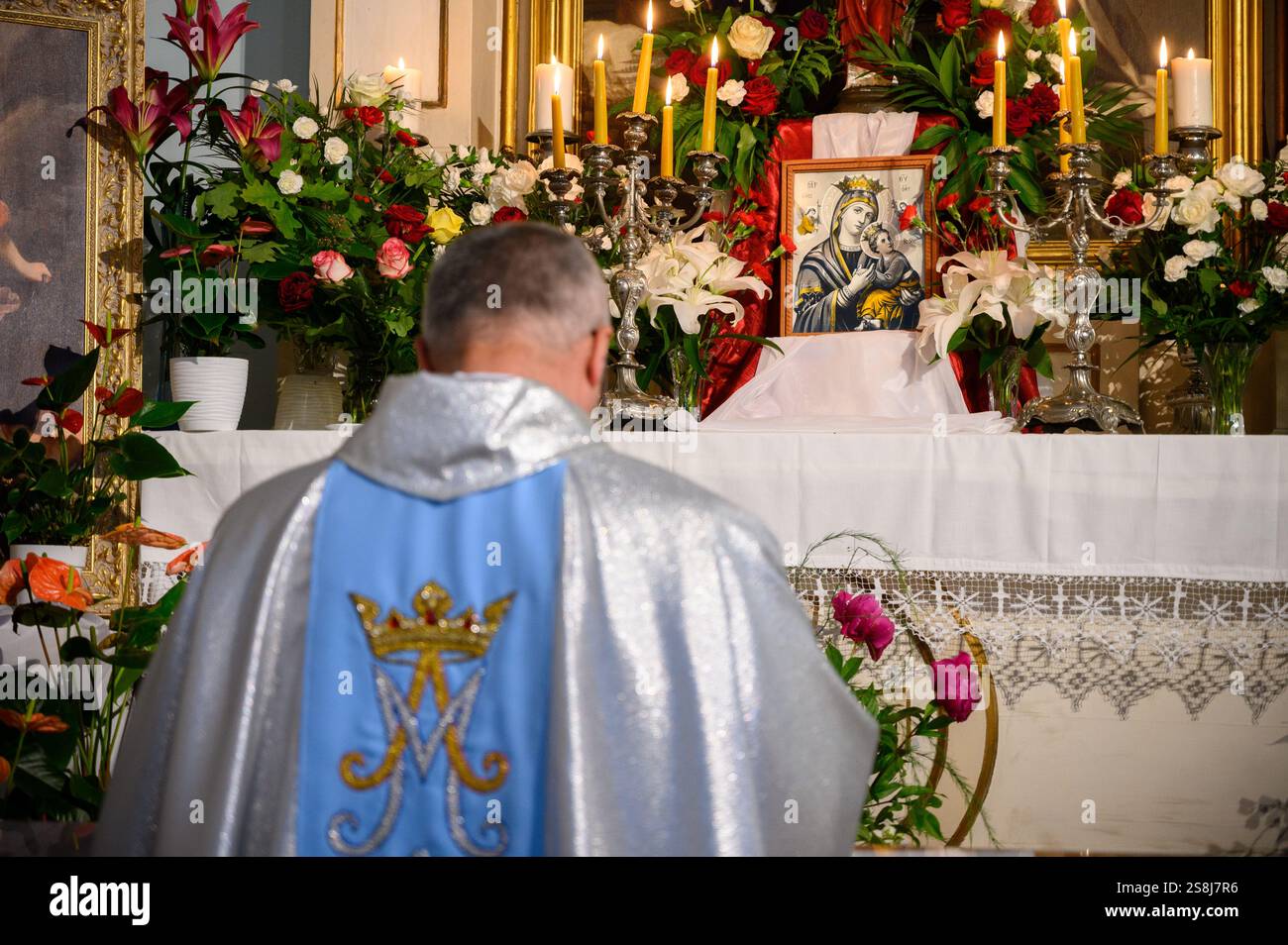 A priest praying to Our Lady of Perpetual Succour. Our Lady of Sorrows ...