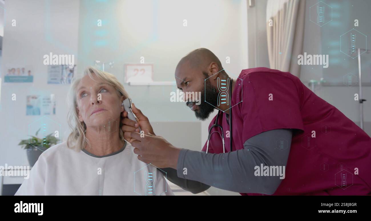 Image of dna scanner icons over diverse male doctor checking ear of ...