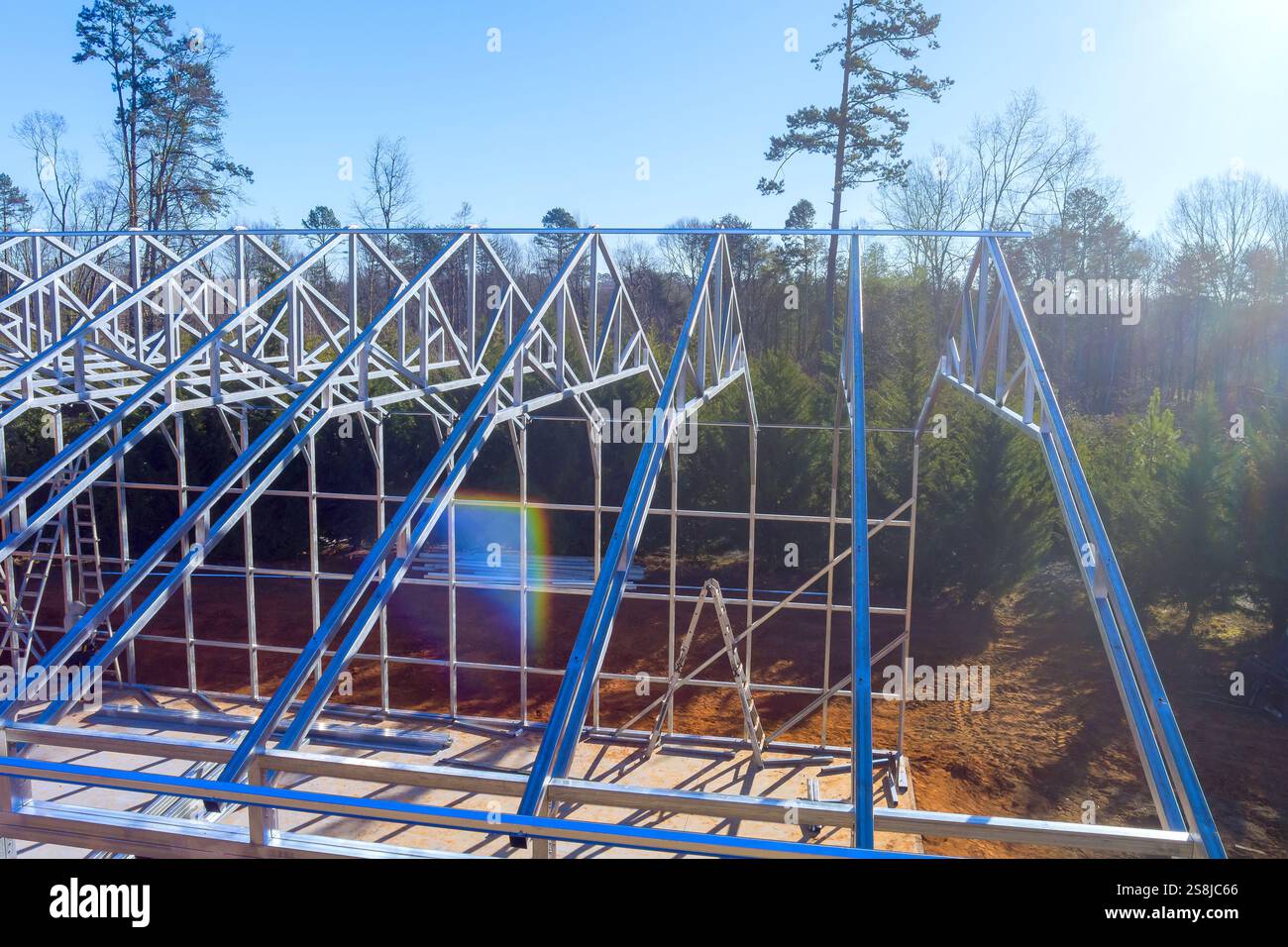 Workers are constructing sturdy it steel beams frame for new structure ...