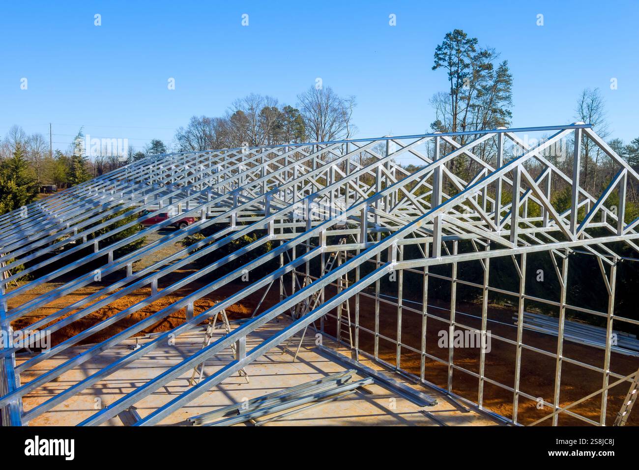 Large metal warehouse is under construction with steel framework ...