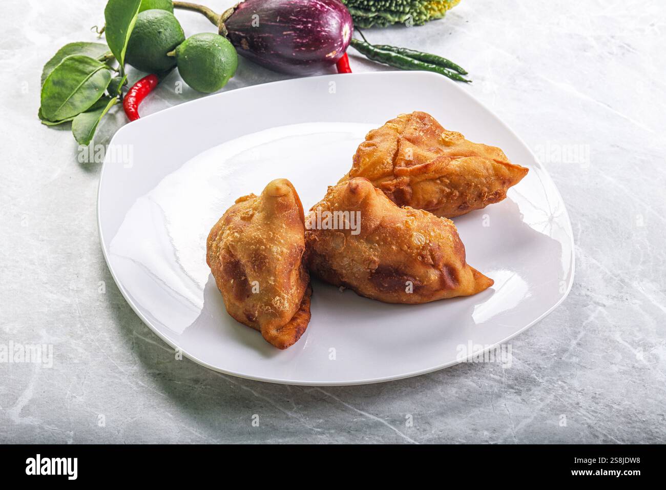 Indian cuisine - fries crispy stuffed samosa Stock Photo - Alamy