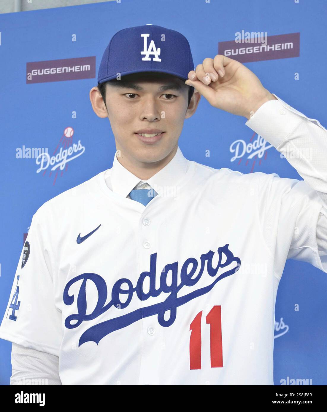 Japanese pitcher Roki Sasaki, poses he is introduceed by the Los ...