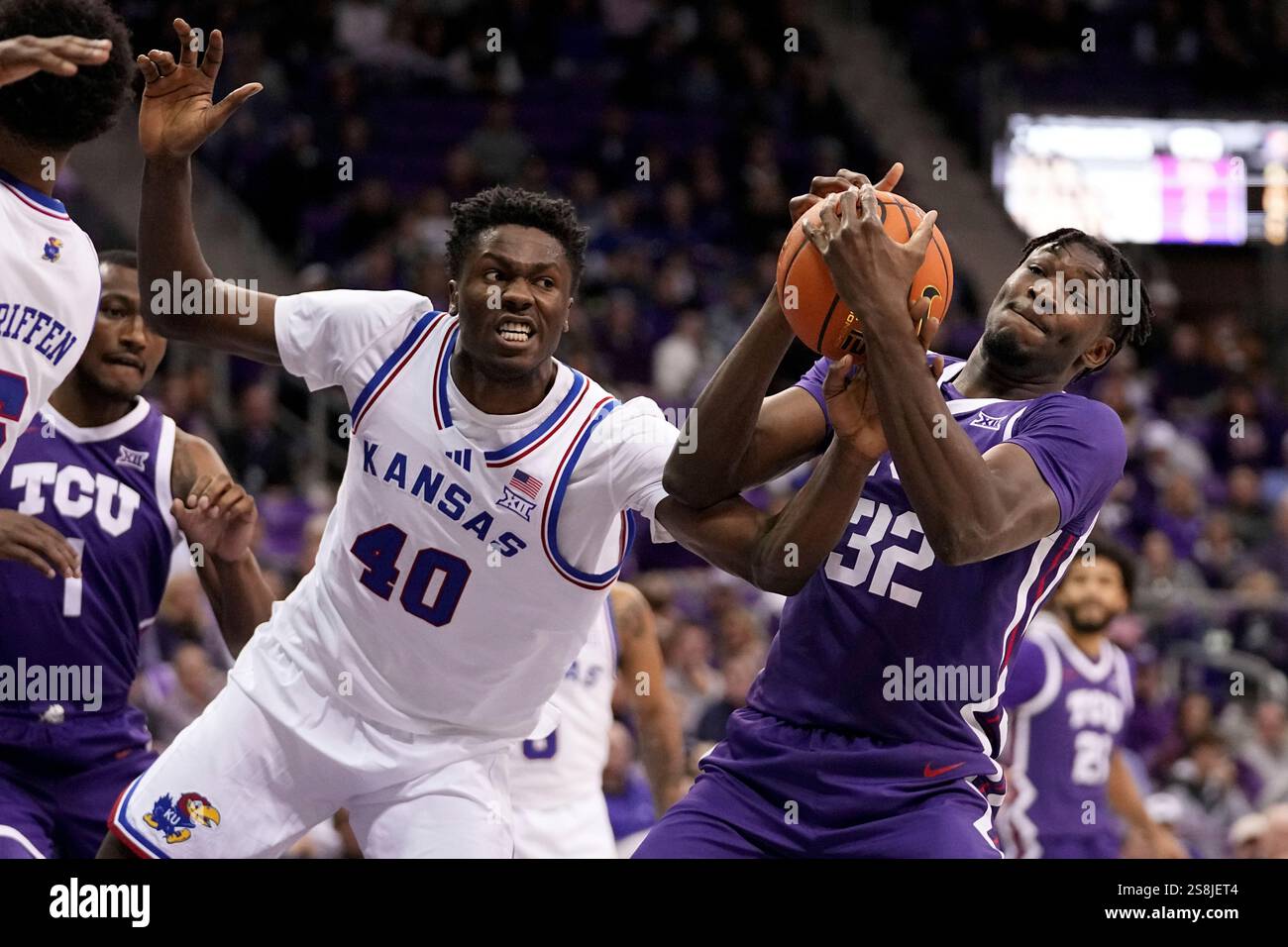 TCU center Malick Diallo (32) grabs a rebound in front of Kansas ...