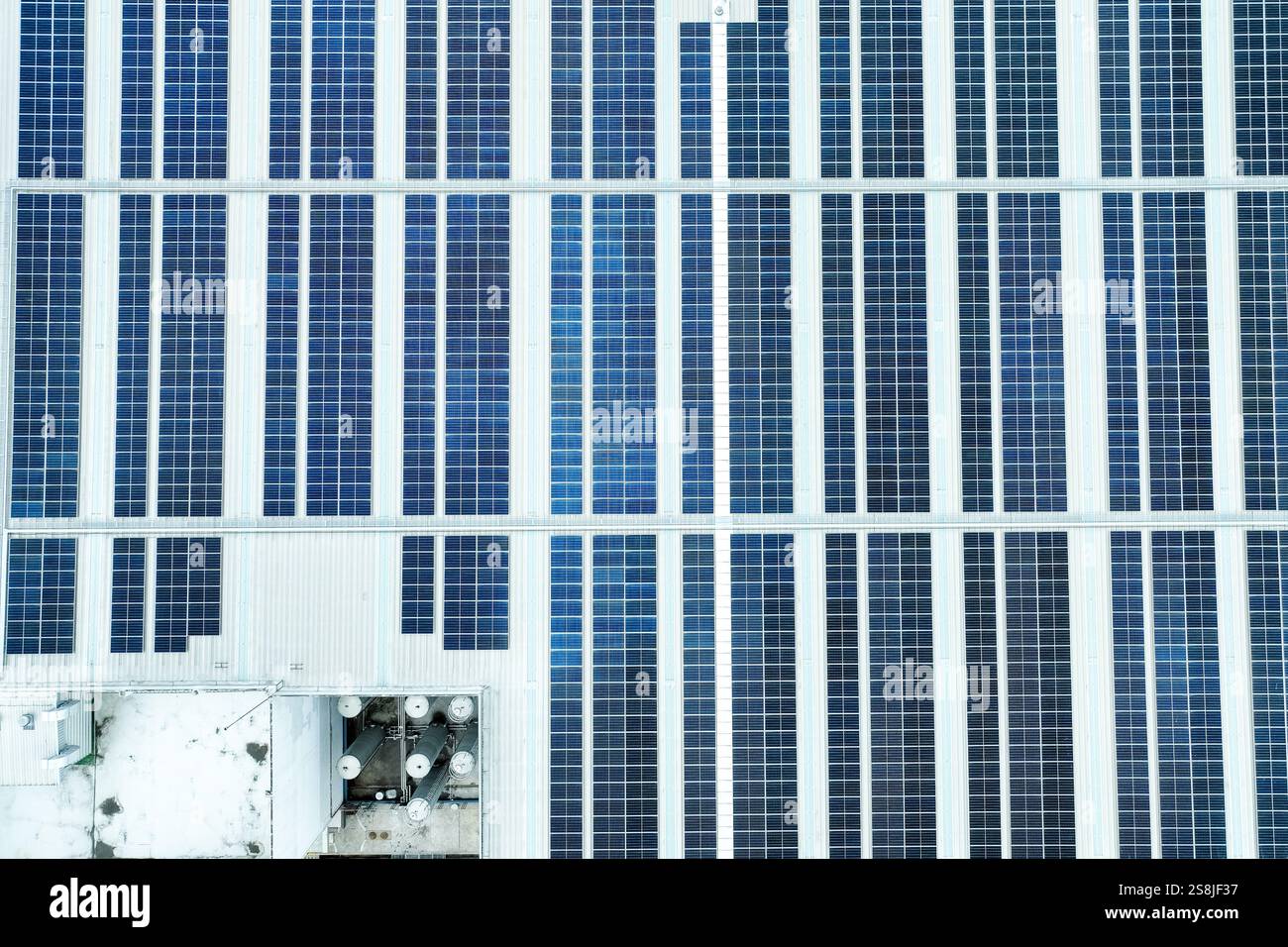 Solar energy for factory and warehouse building. Solar panels on roof ...