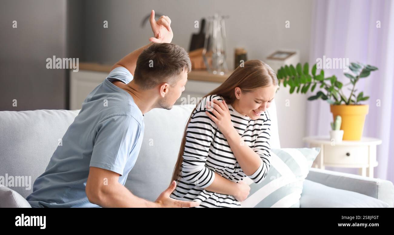 Angry husband shouting at his scared wife at home Stock Photo - Alamy