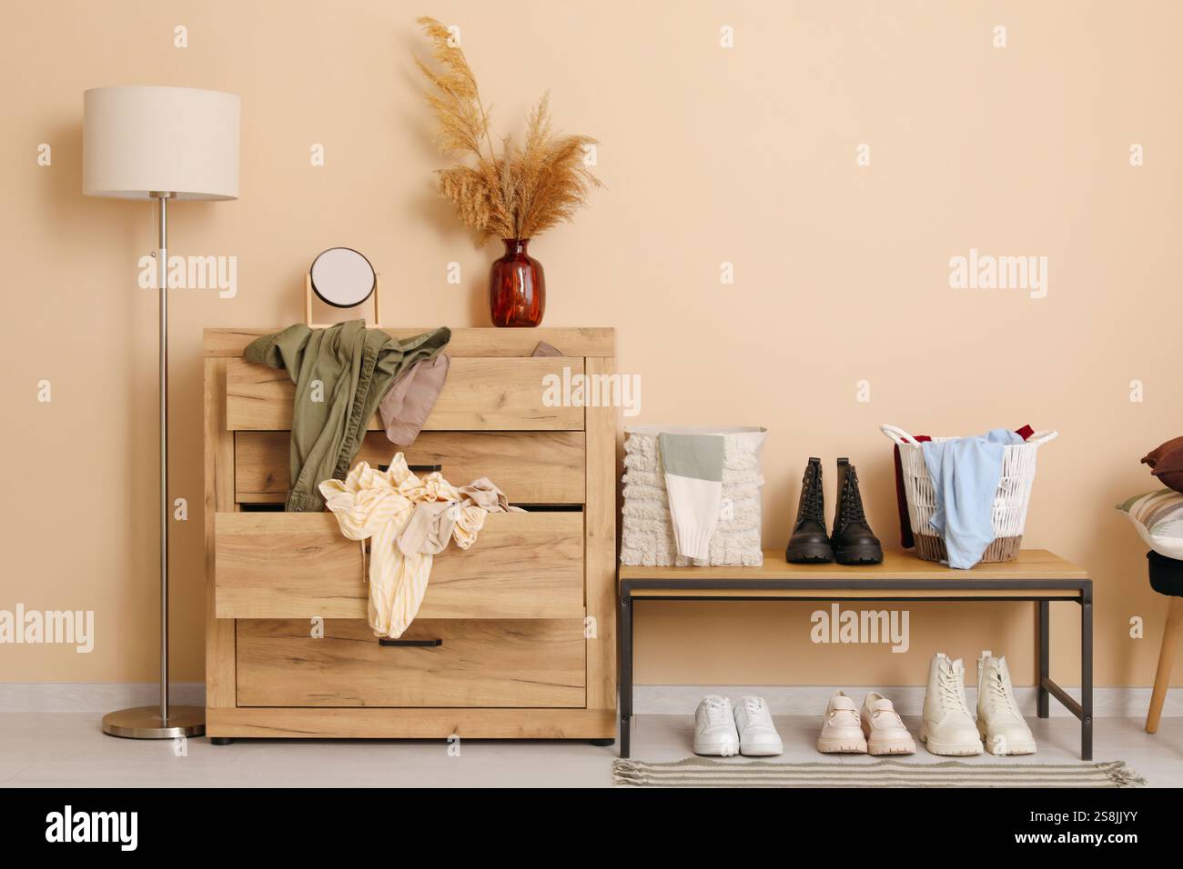 Interior of dressing room with drawers, bench and lamp Stock Photo - Alamy