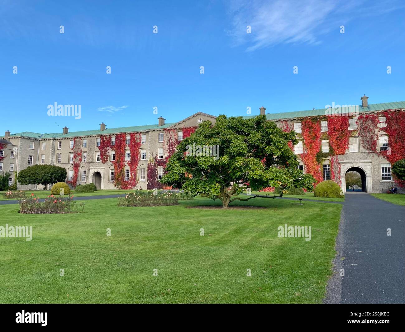 View of Maynooth university building against blue sky Stock Photo - Alamy