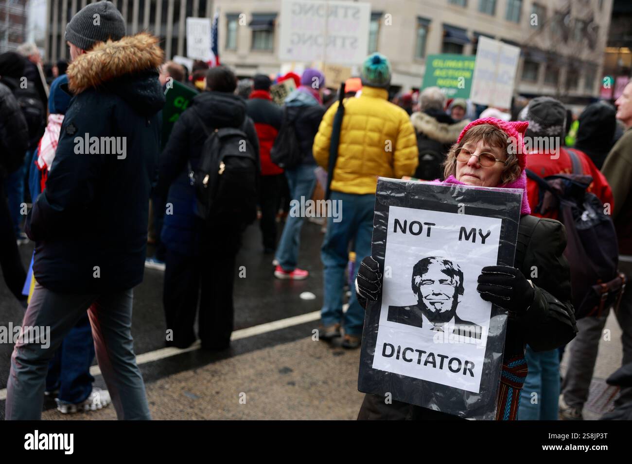 Washington, United States. 18th Jan, 2025. A woman holds a sign reading ...