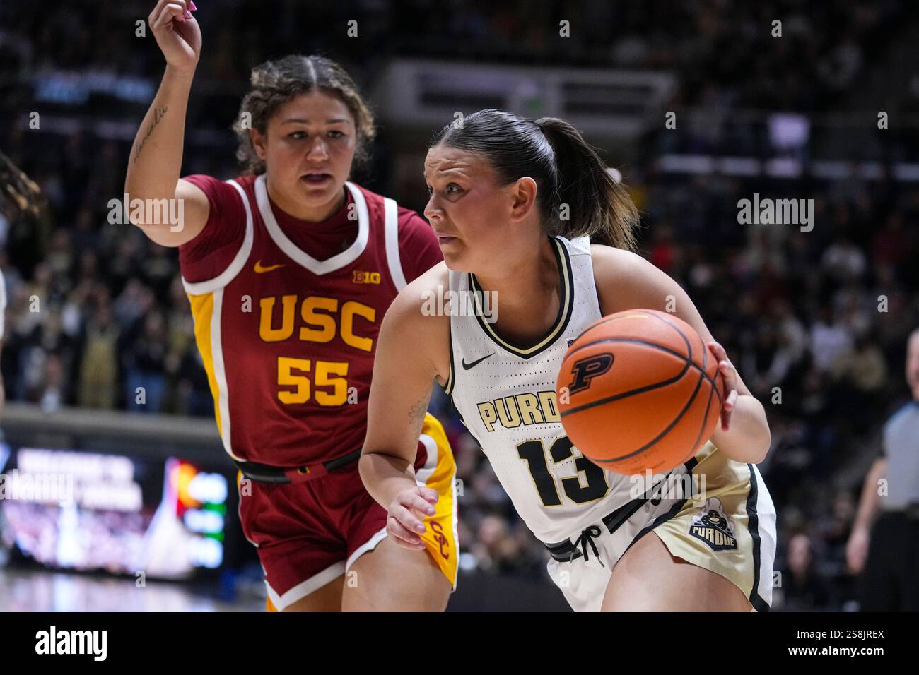 Purdue guard Ella Collier (13) drives on USC guard Talia von Oelhoffen ...