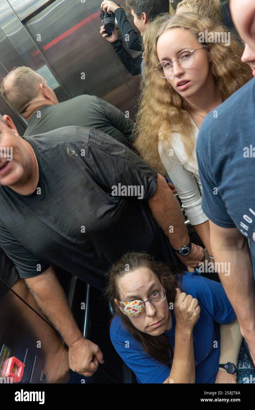 Bangkok, thailand - Dec 25 2024: Group of people in a crowded elevator ...