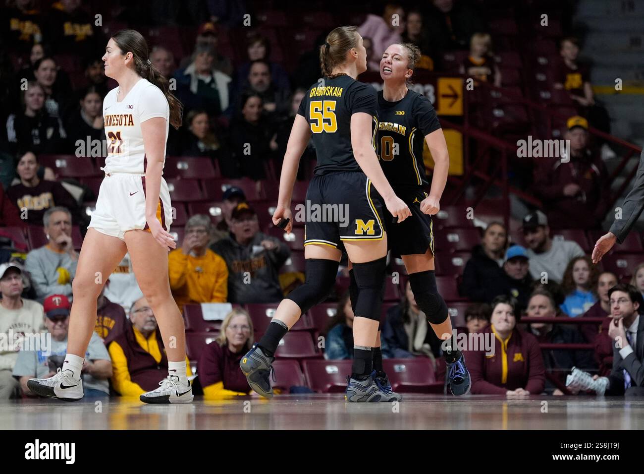 Michigan guard Jordan Hobbs (10), right, celebrates with center Yulia ...