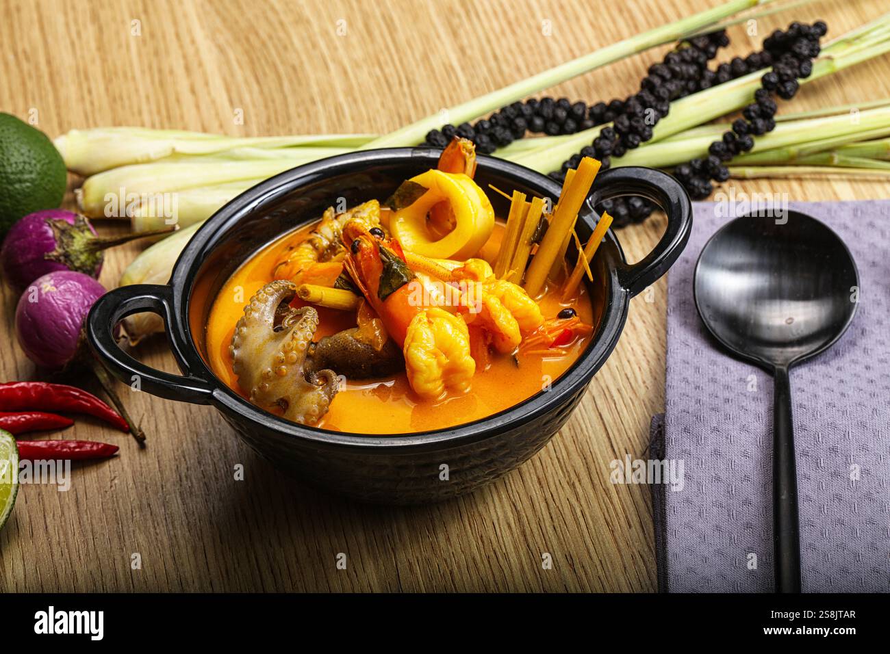 Thai Tom Yum soup with seafood - prawn, octopus and squid Stock Photo ...