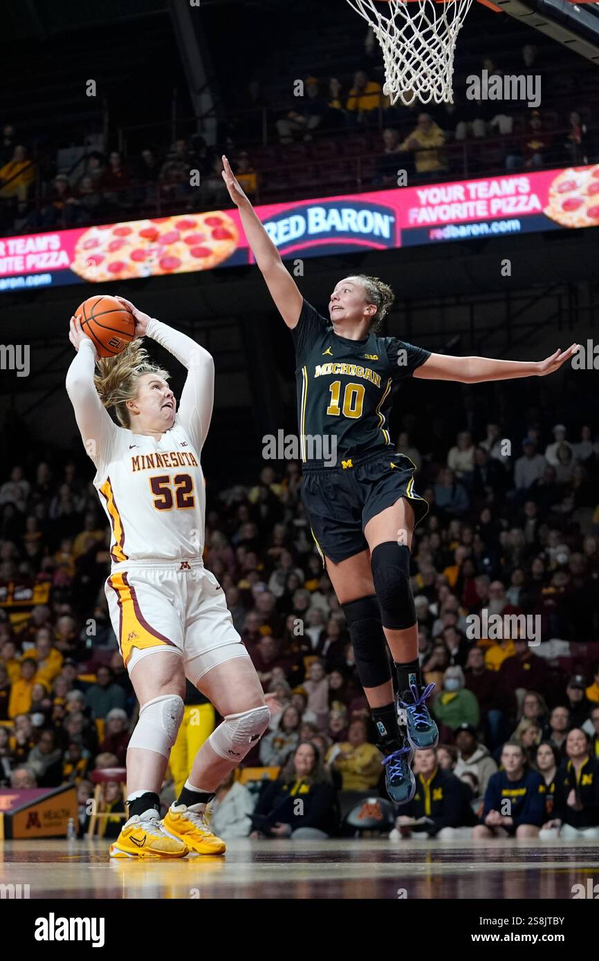 Minnesota center Sophie Hart (52) prepares to take a shot as Michigan ...