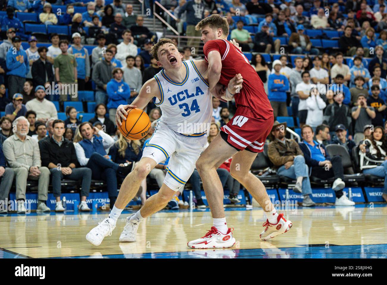 UCLA Bruins forward Tyler Bilodeau (34) drives against Wisconsin ...