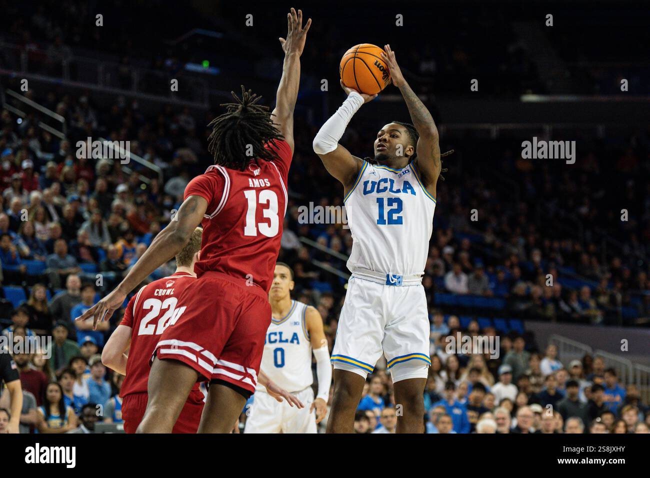 UCLA Bruins guard Sebastian Mack (12) shoots over Wisconsin Badgers ...