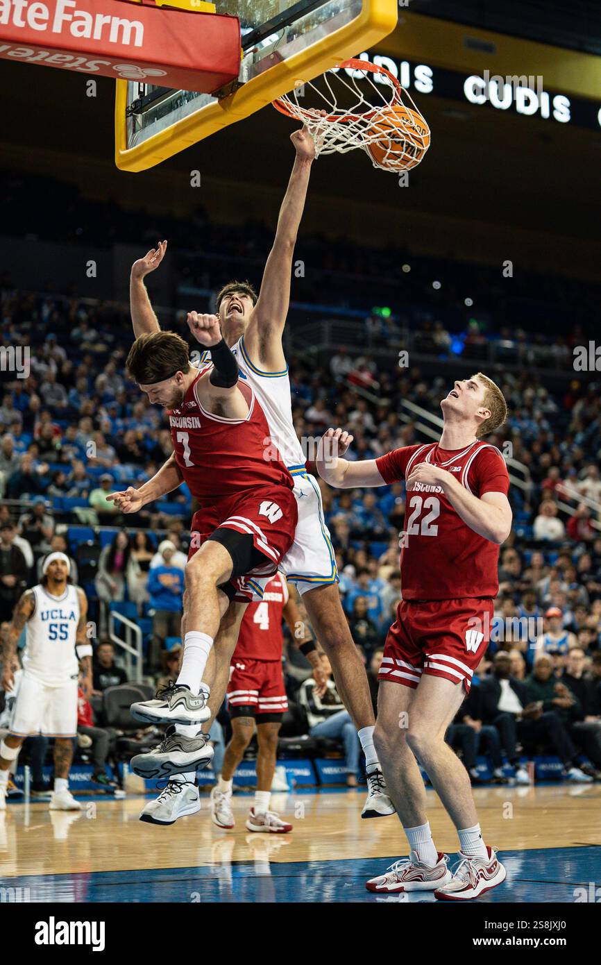 UCLA Bruins center Aday Mara (15) dunks over Wisconsin Badgers forward ...