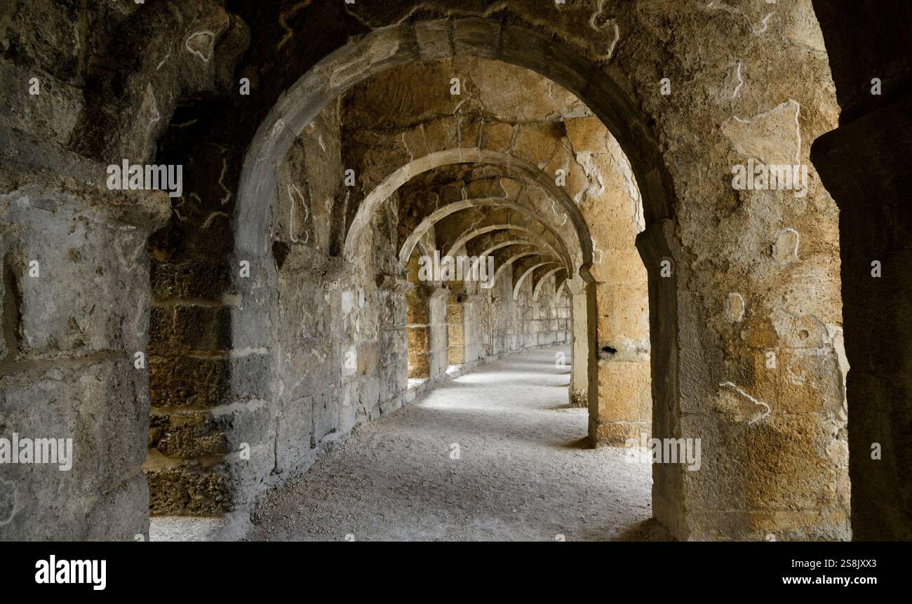 Upper level walkway of ancient Roman Amphitheater, Aspendos, Turkey ...