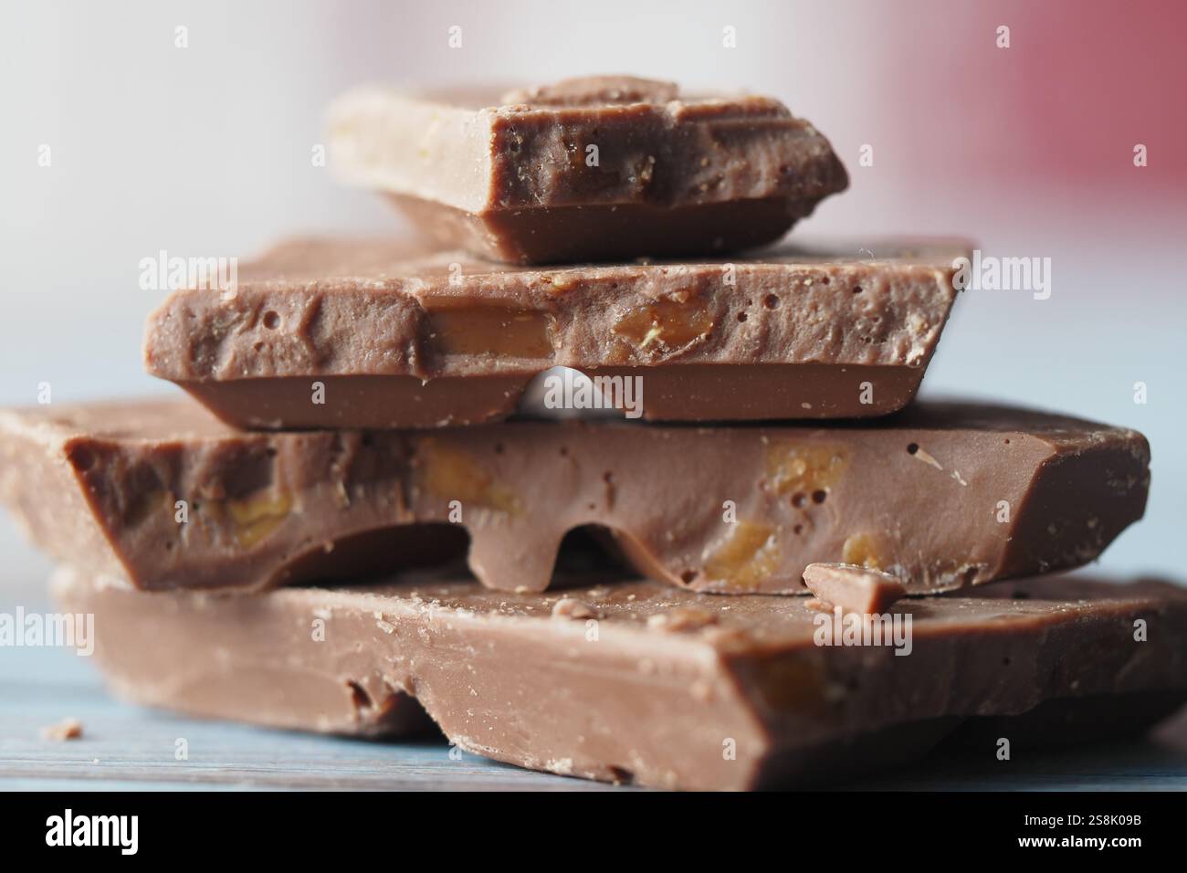 A Mouthwatering Stack of Delicious Chocolate Bars on a Rustic Background Stock Photo - Alamy