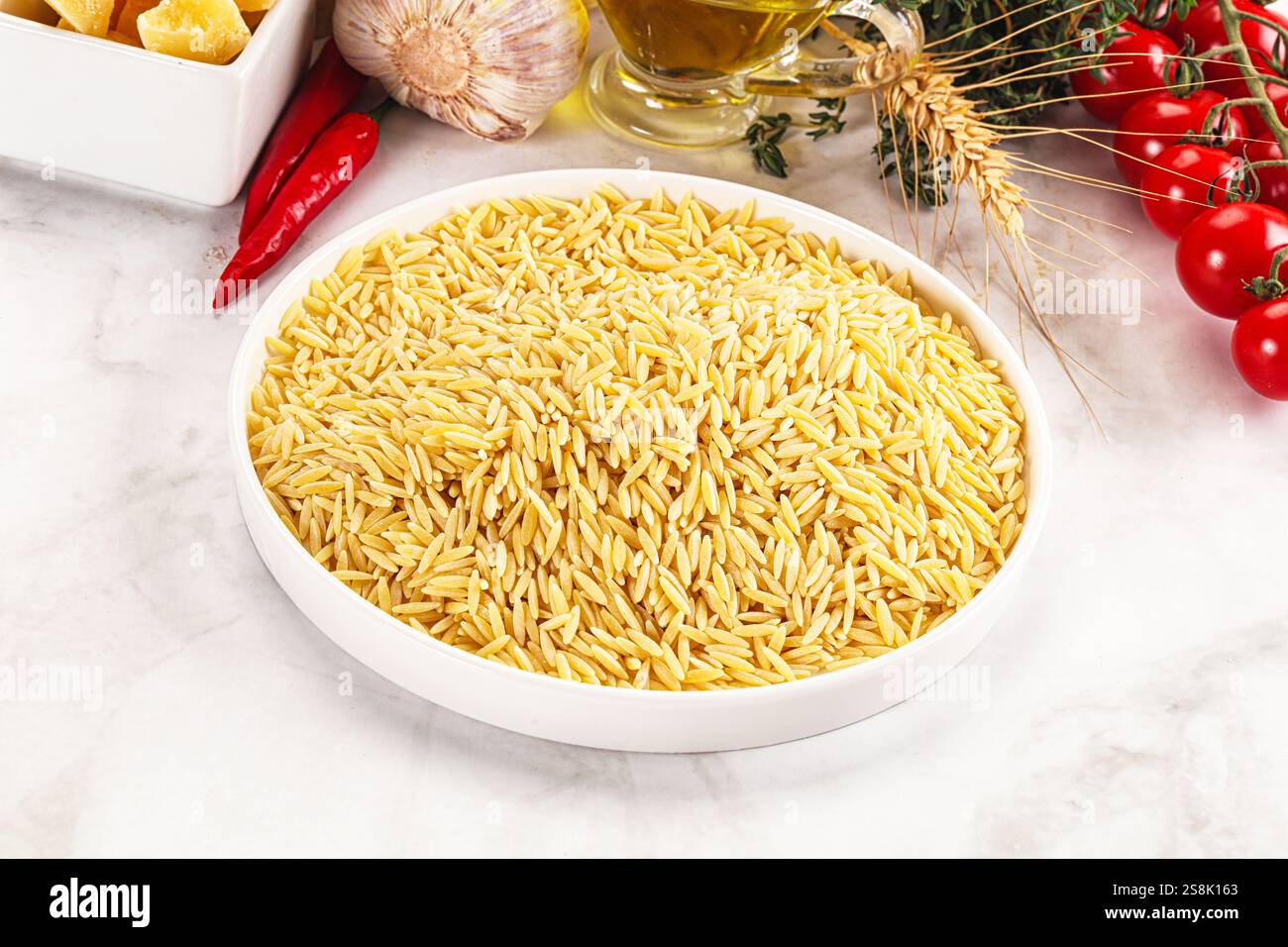 Italian raw dry pasta risoni for cooking Stock Photo - Alamy