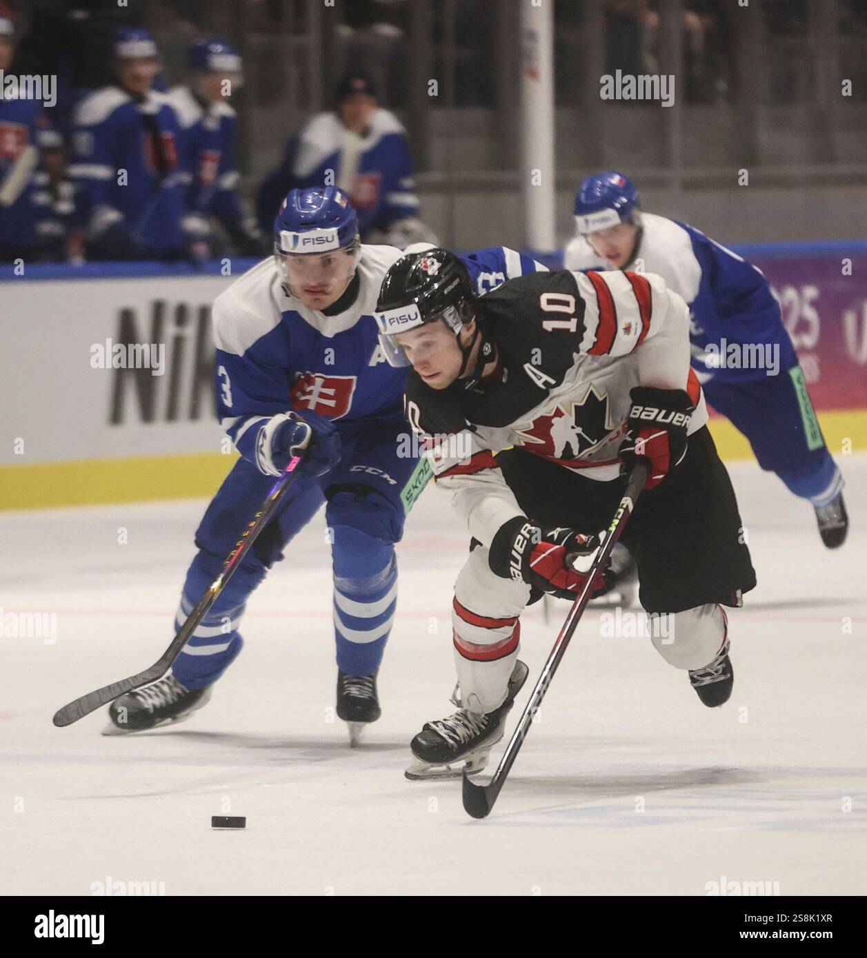 Turin, Italy. 22nd Jan, 2025. Benjamin Corbeil (front) of Canada ...