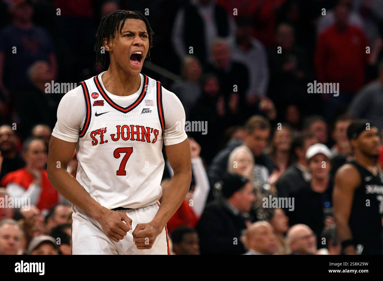 St. John's guard Simeon Wilcher (7) yells during the second half of an ...