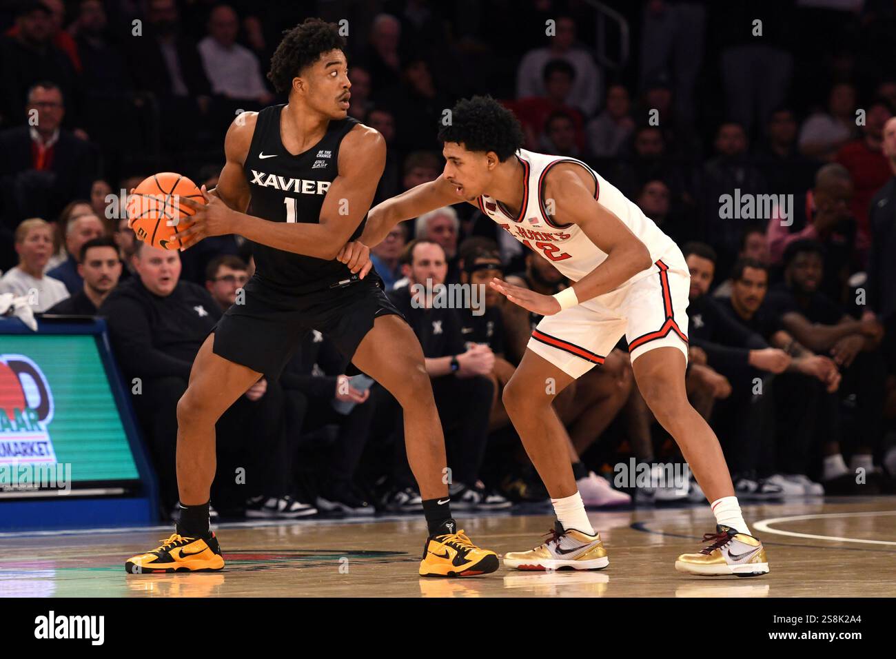Xavier guard Marcus Foster (1) looks to pass the ball past St. John's ...