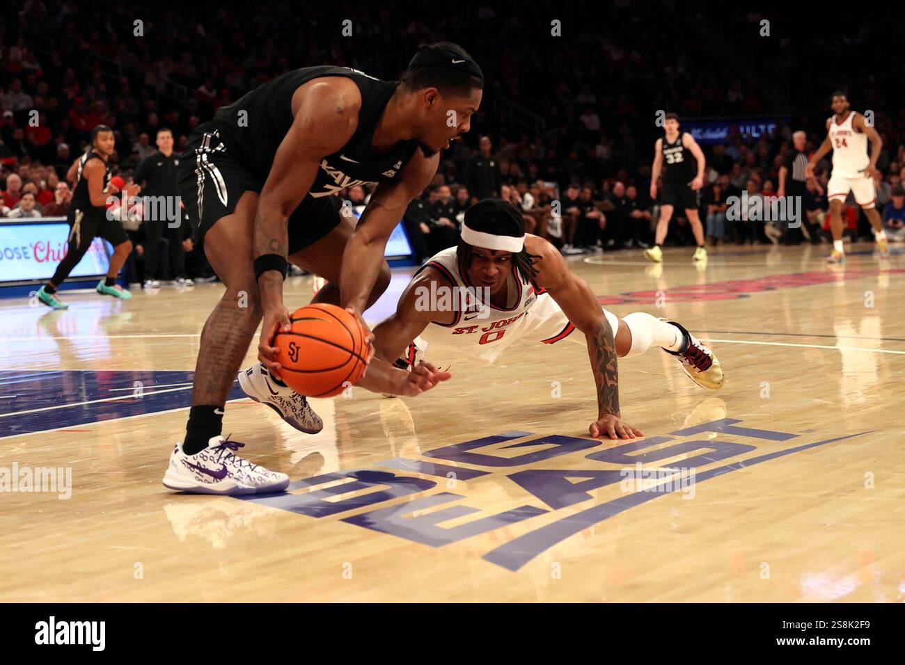 Xavier guard Ryan Conwell, left, and St. John's guard Aaron Scott (0 ...