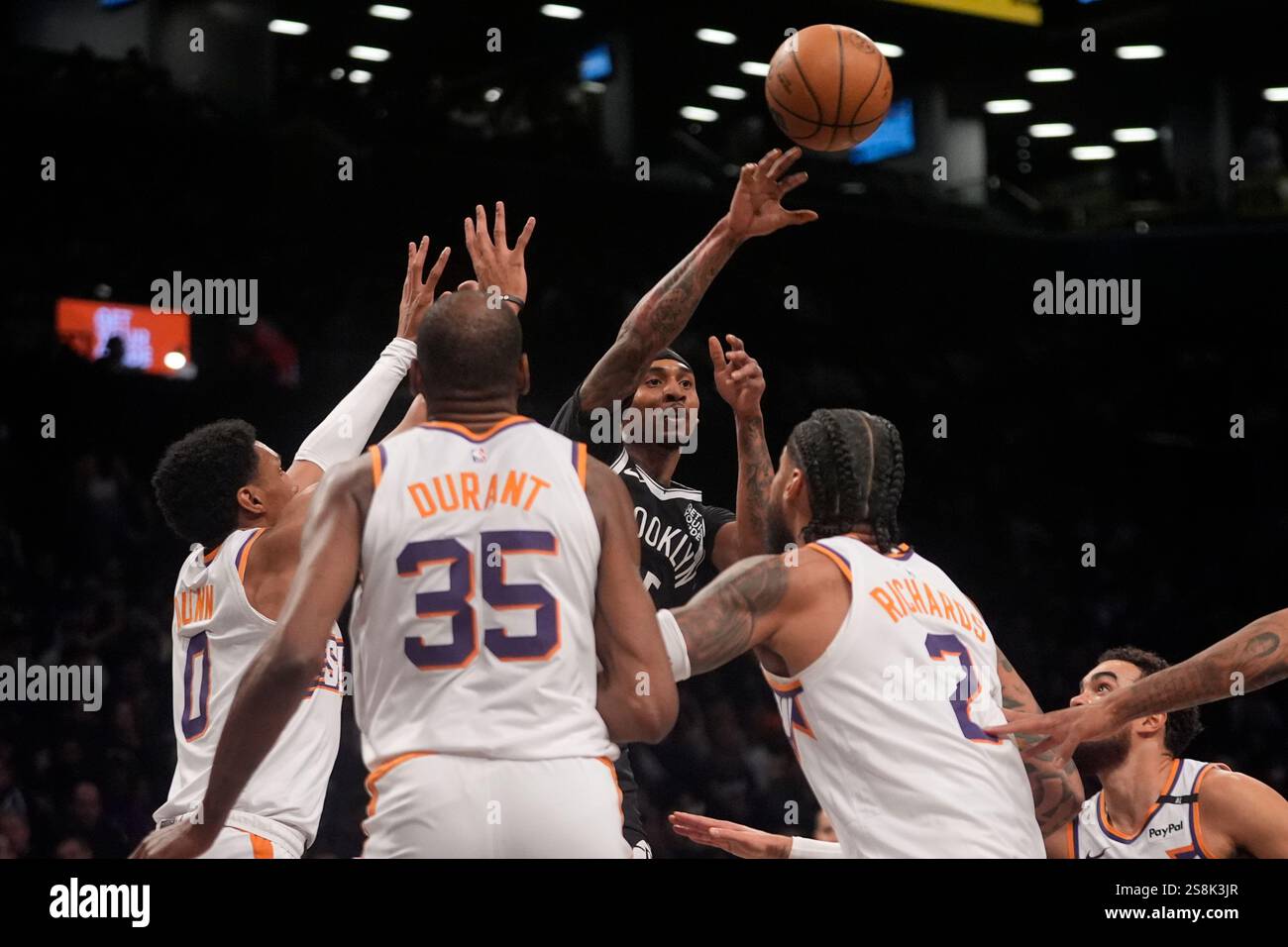 Brooklyn Nets' Keon Johnson (45) passes the ball away from Phoenix Suns ...